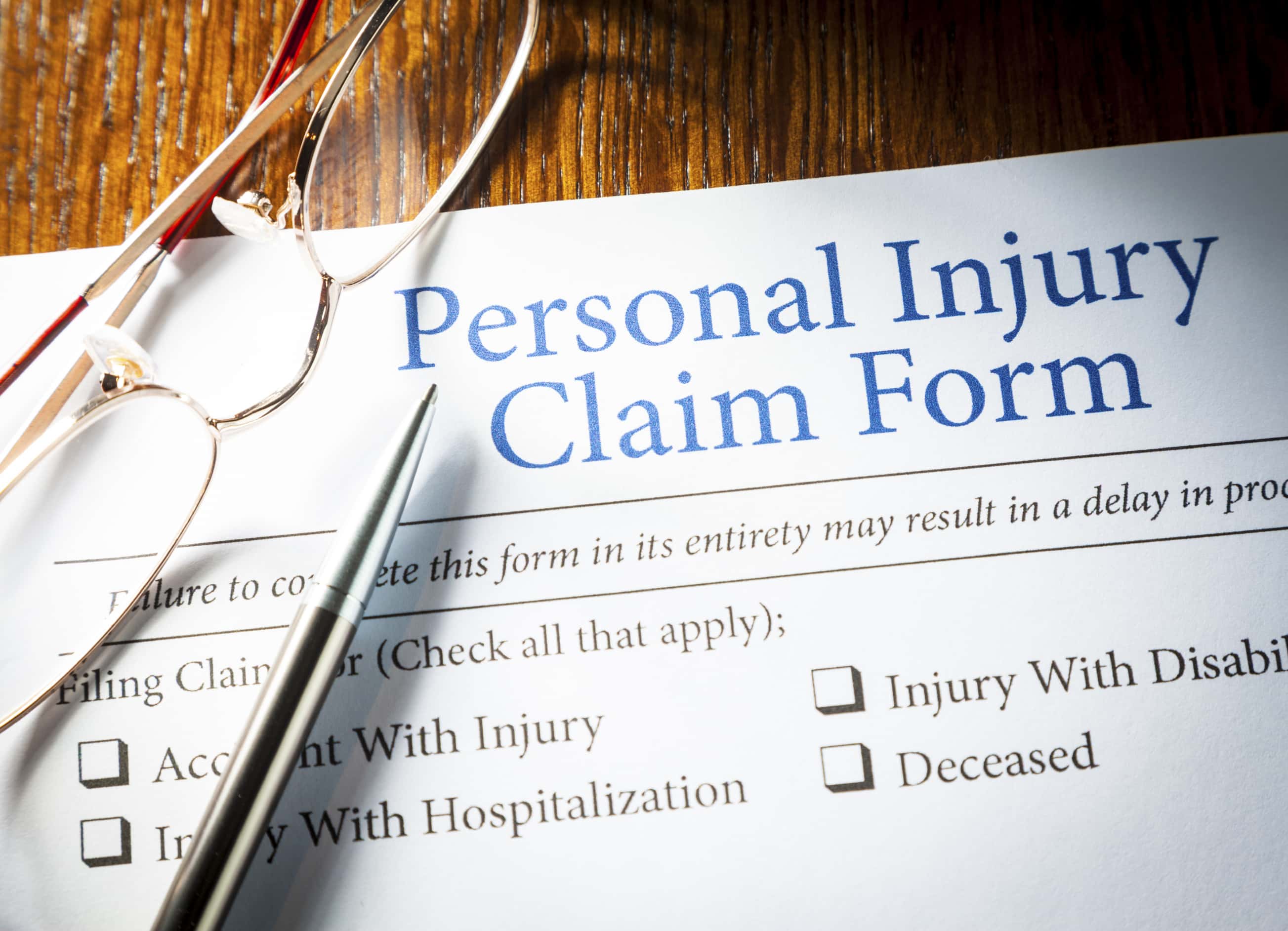 Personal Injury Claim Form With Pen And Glasses Fontana California Personal Injury Claim Form With Pen And Glasses Fontana California